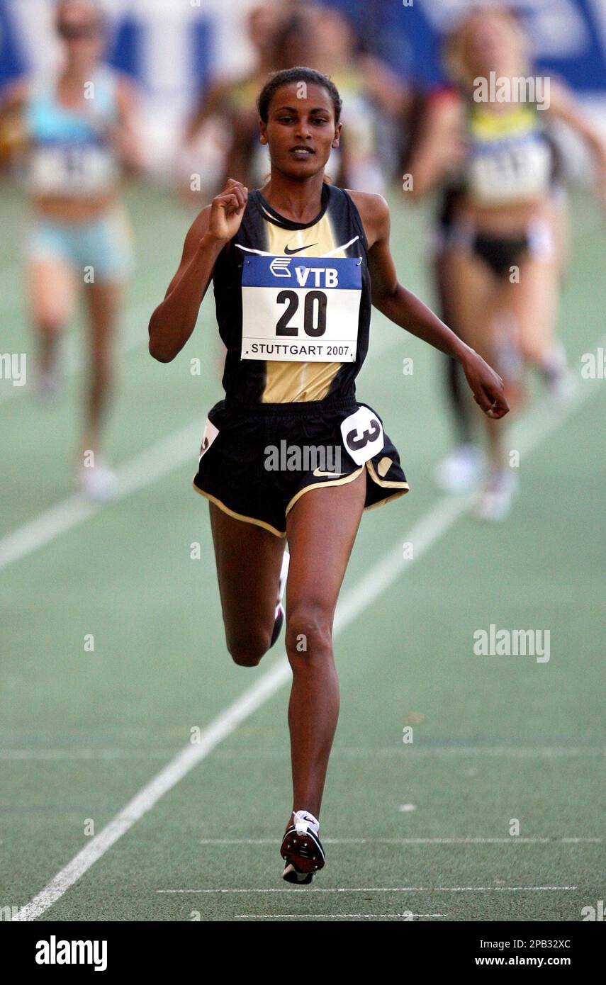 Bahrain's Maryam Yusuf Jamal celebrates as she crosses the line to win ...