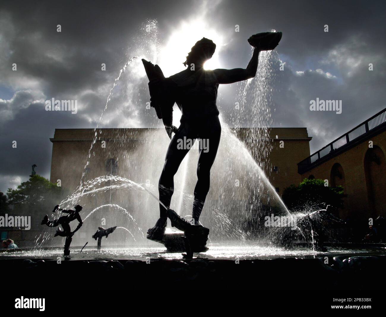 A fountain with a large statue of Poseidon stands in front of the Art ...