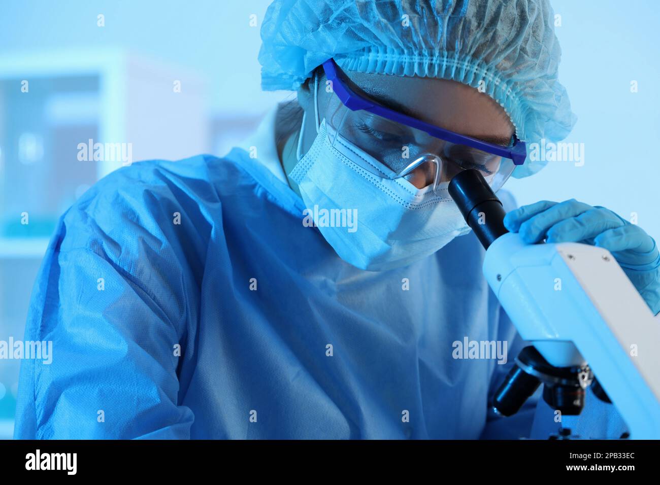 Scientist working with microscope in laboratory. Medical research Stock ...