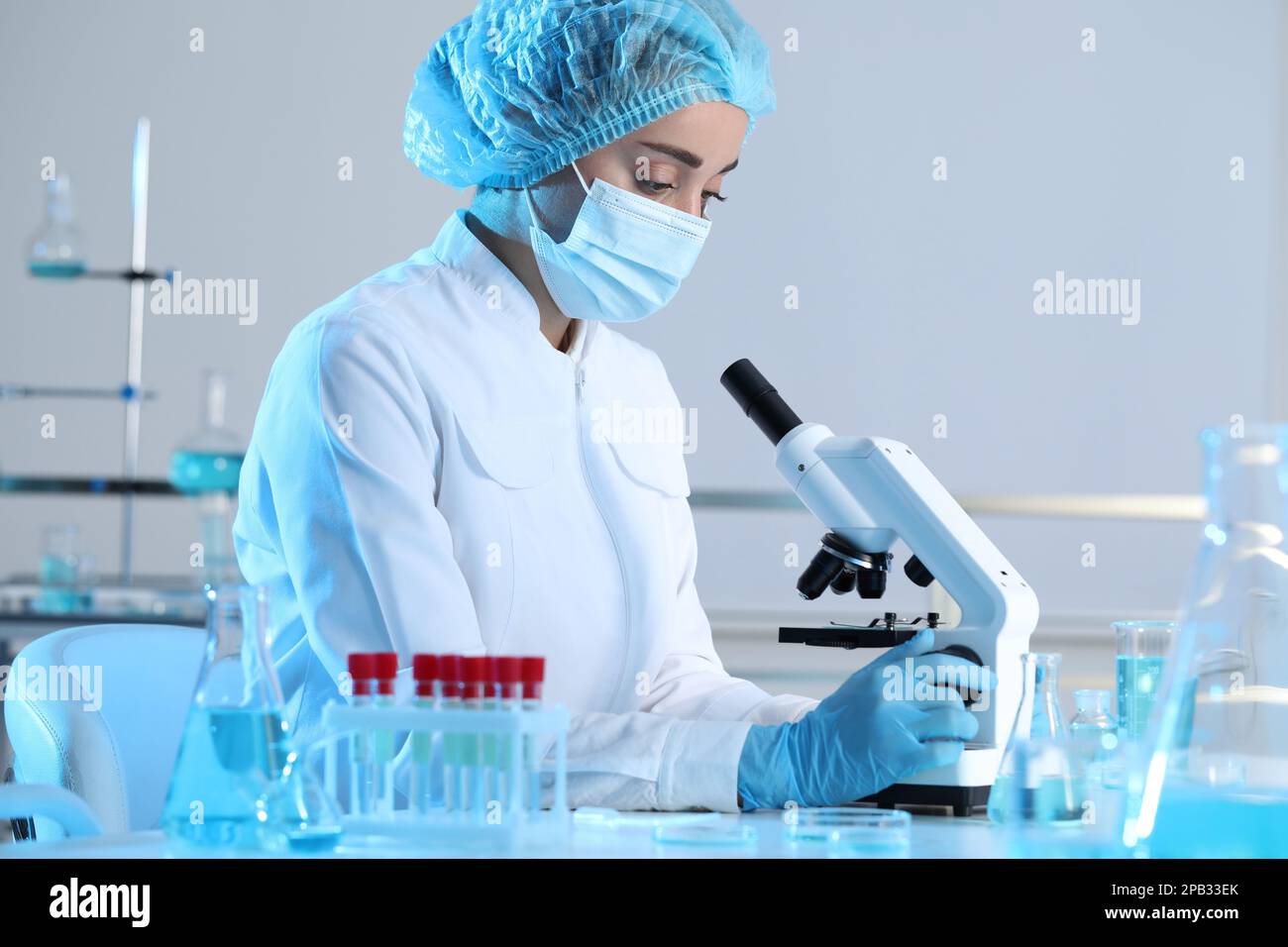 Scientist working with microscope in laboratory. Medical research Stock ...