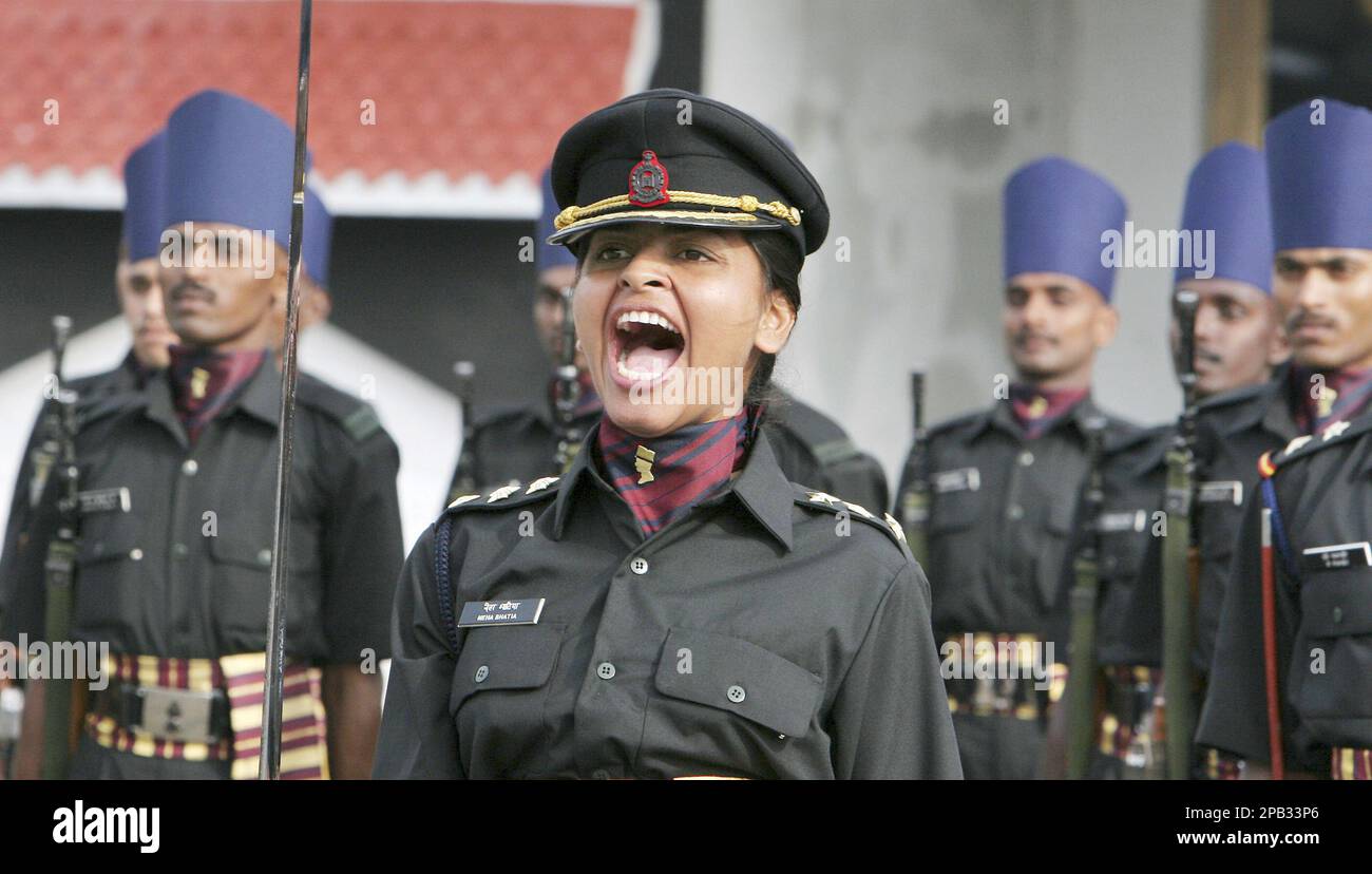 An Indian army officer gives a command to her colleagues at a parade ...