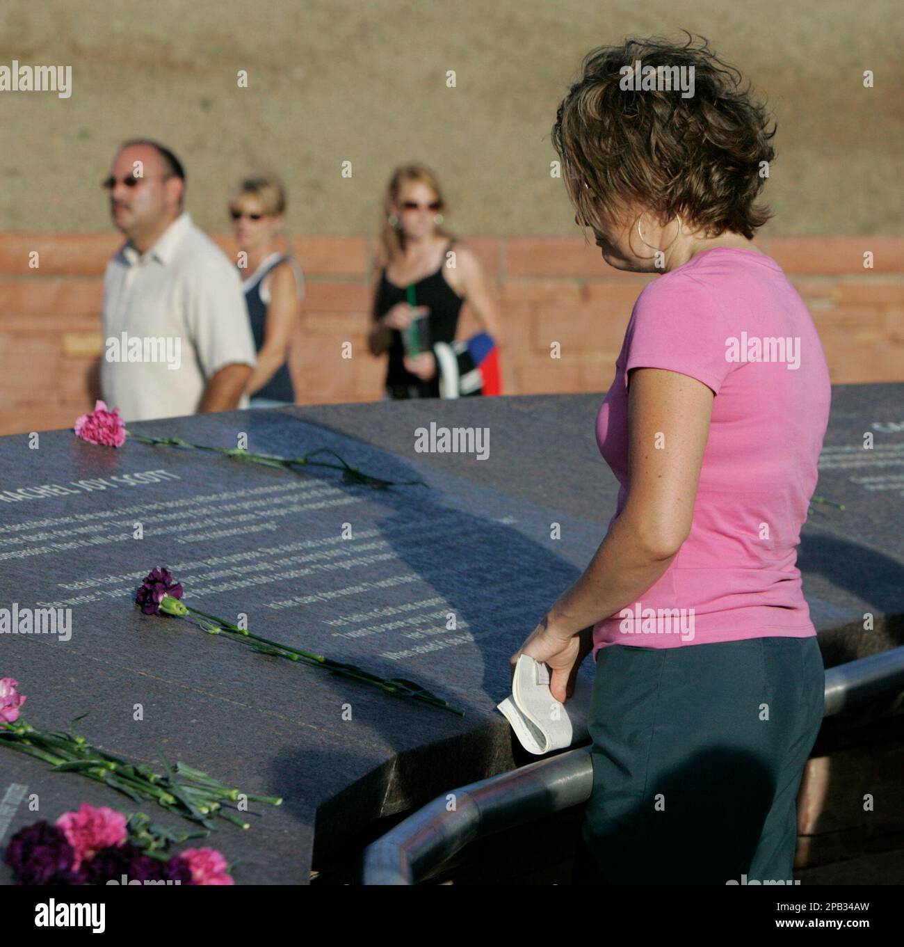 A woman reads the inscription for Rachel Joy Scott one of the student ...