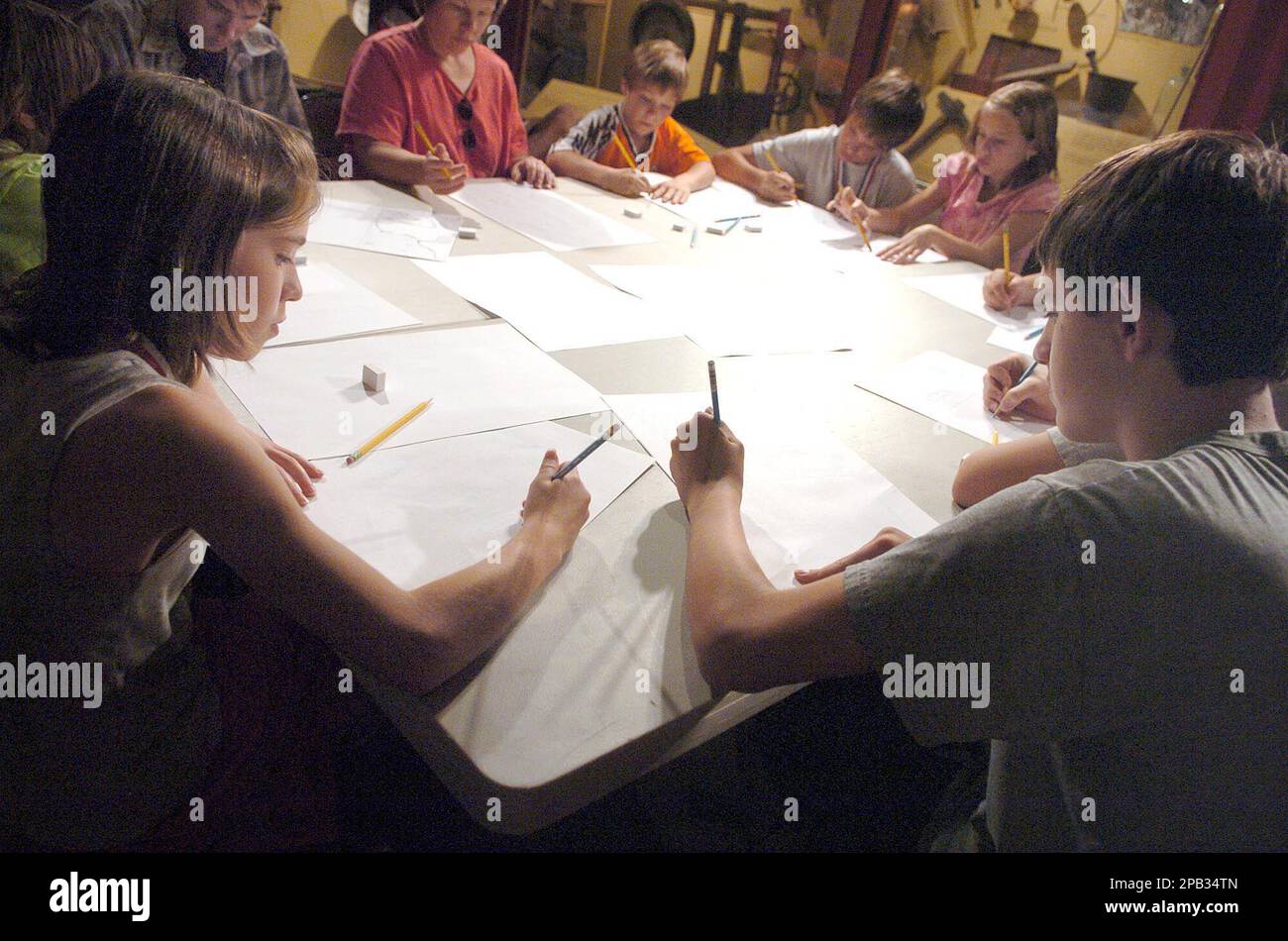 Genevieve Thibodeau, left, and Ethan Carter, both 13-years-old, create ...