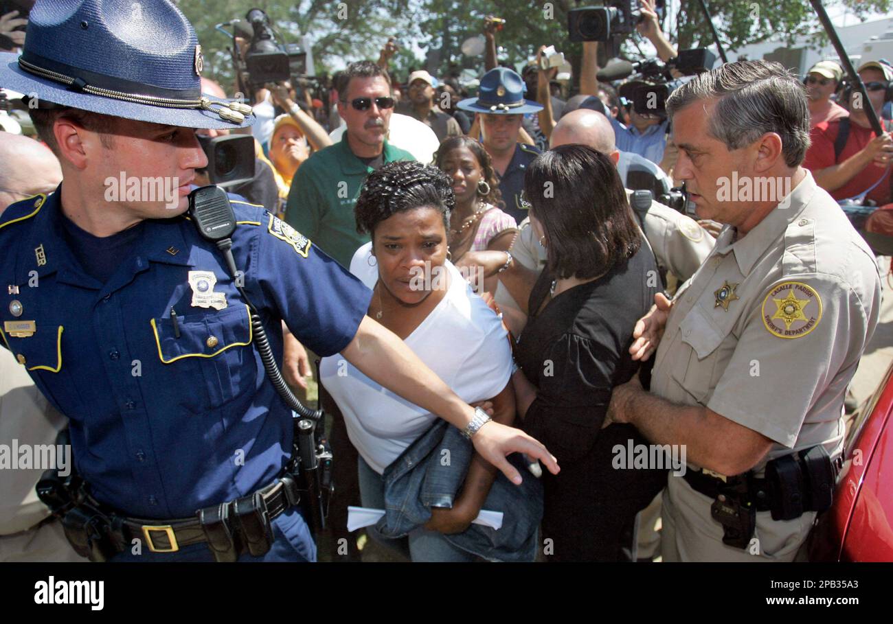 Melissa Bell, second from left, leaves after a hearing for her son ...