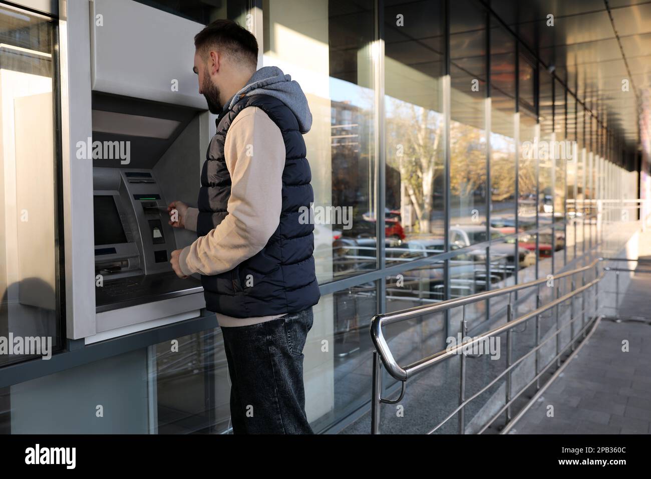 Young man cash machine hi-res stock photography and images - Alamy