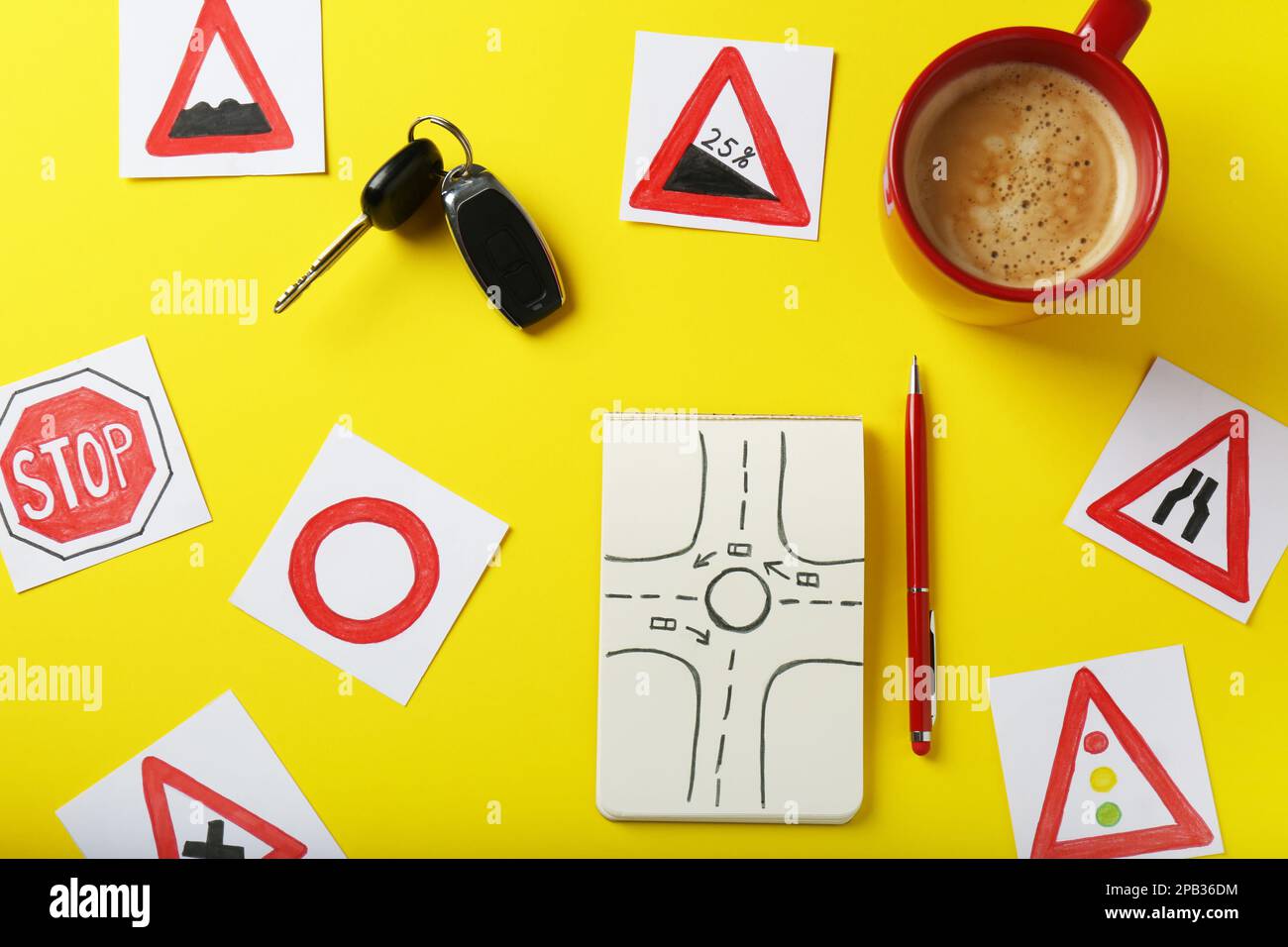 Flat lay composition with workbook for driving lessons and road signs ...