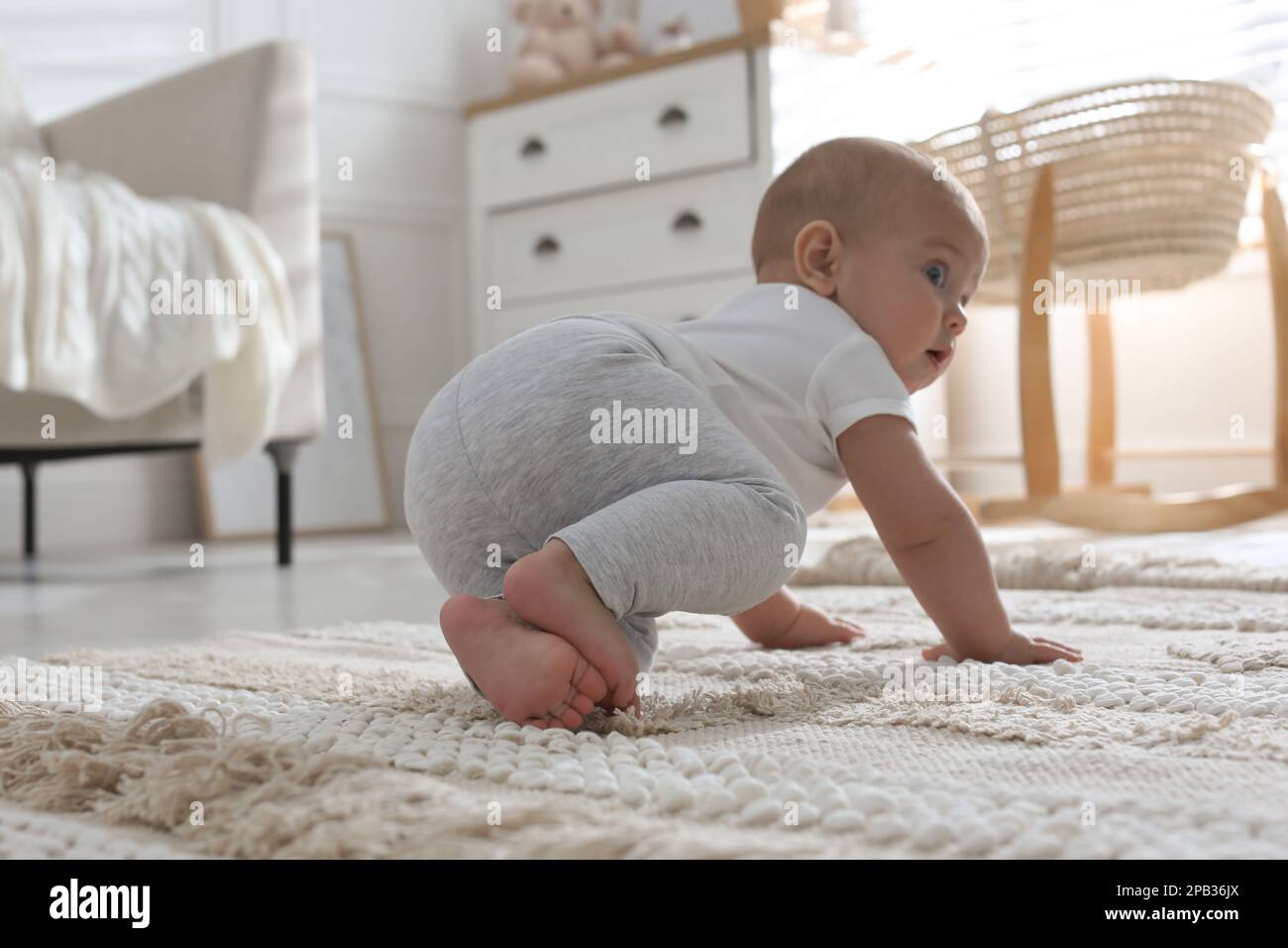 Cute baby crawling at home, focus on legs Stock Photo - Alamy