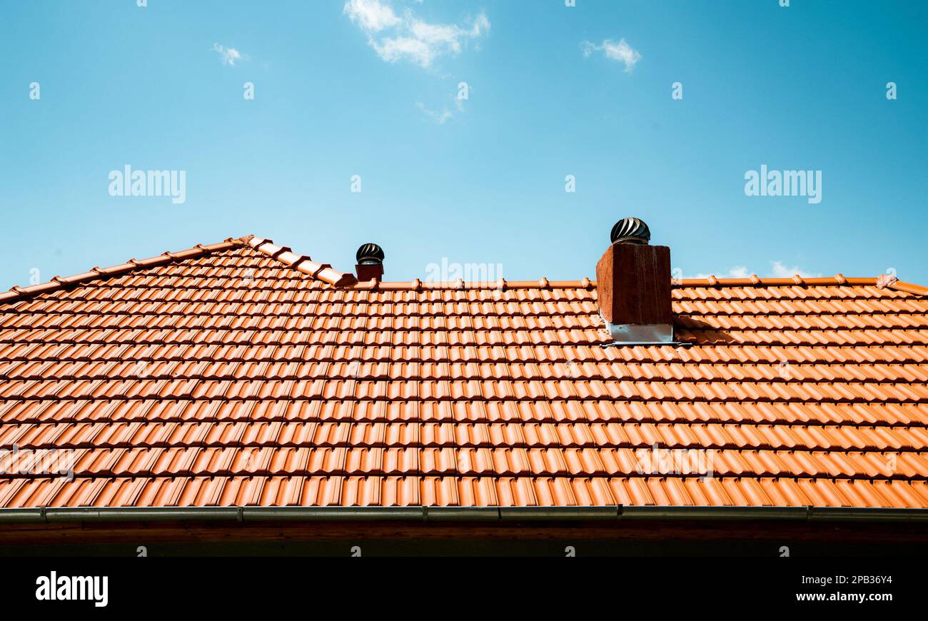 new red tiles roof and blue sky Stock Photo - Alamy