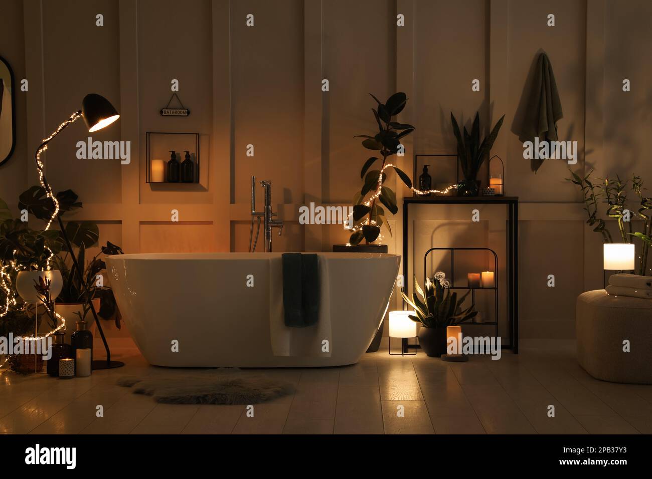 Stylish bathroom interior with houseplants and string lights. Home ...