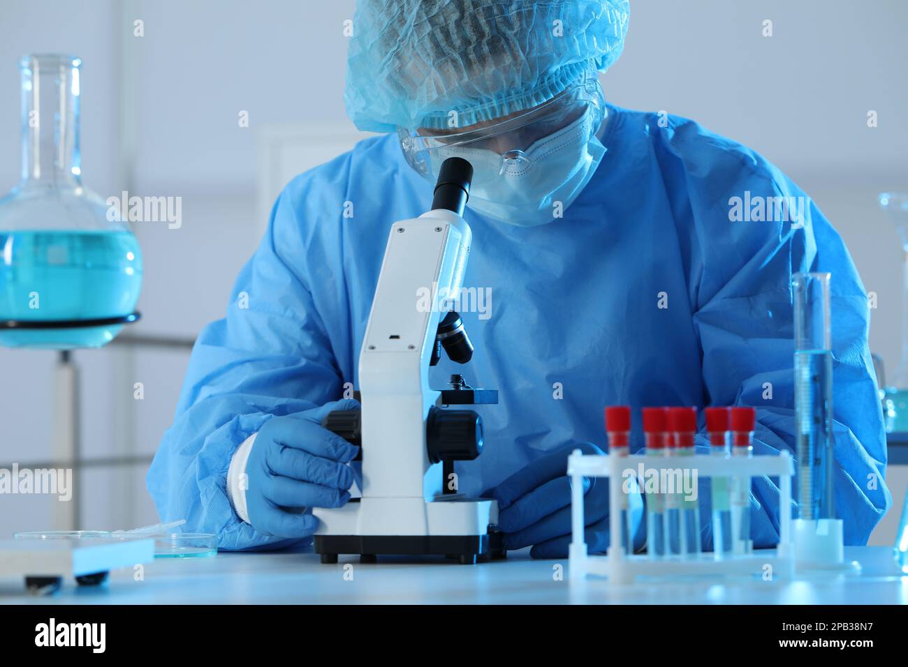 Scientist working with microscope in laboratory. Medical research Stock ...