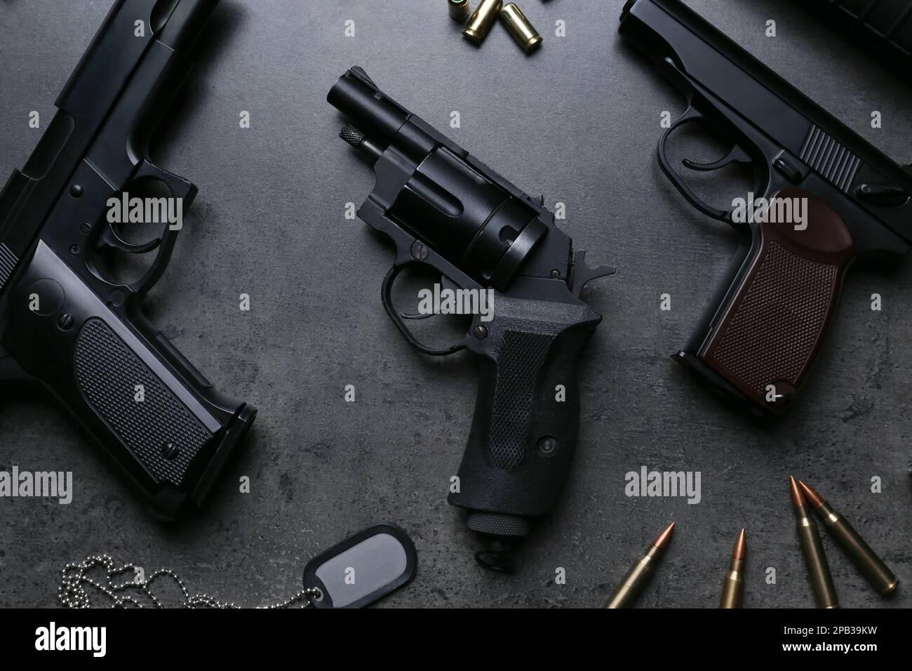 Flat lay composition with professional guns on black background Stock ...