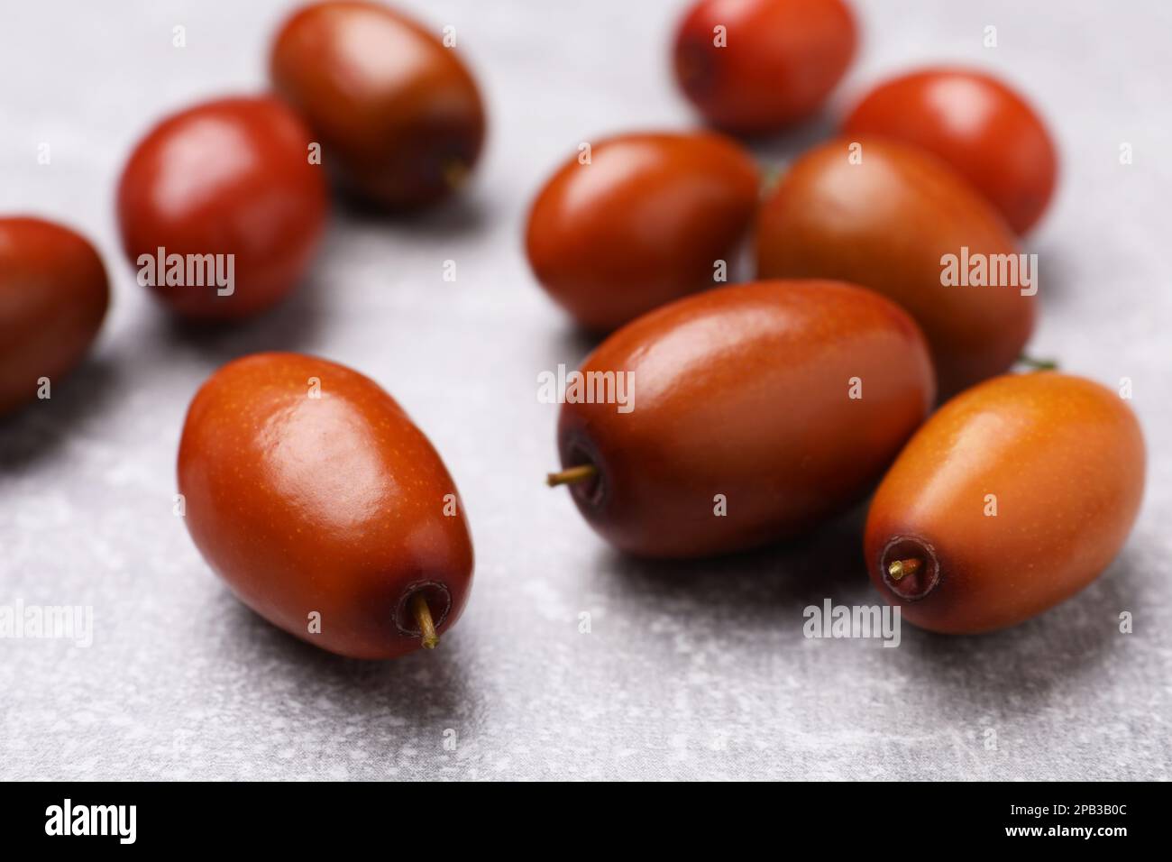 Fresh Ziziphus jujuba fruits on light table, closeup Stock Photo - Alamy