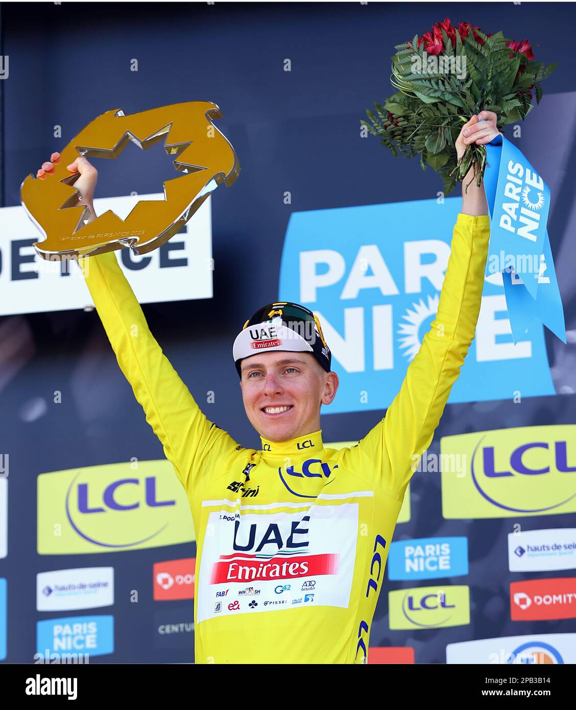 Slovenian Tadej Pogacar of UAE Team Emirates celebrates on the podium ...