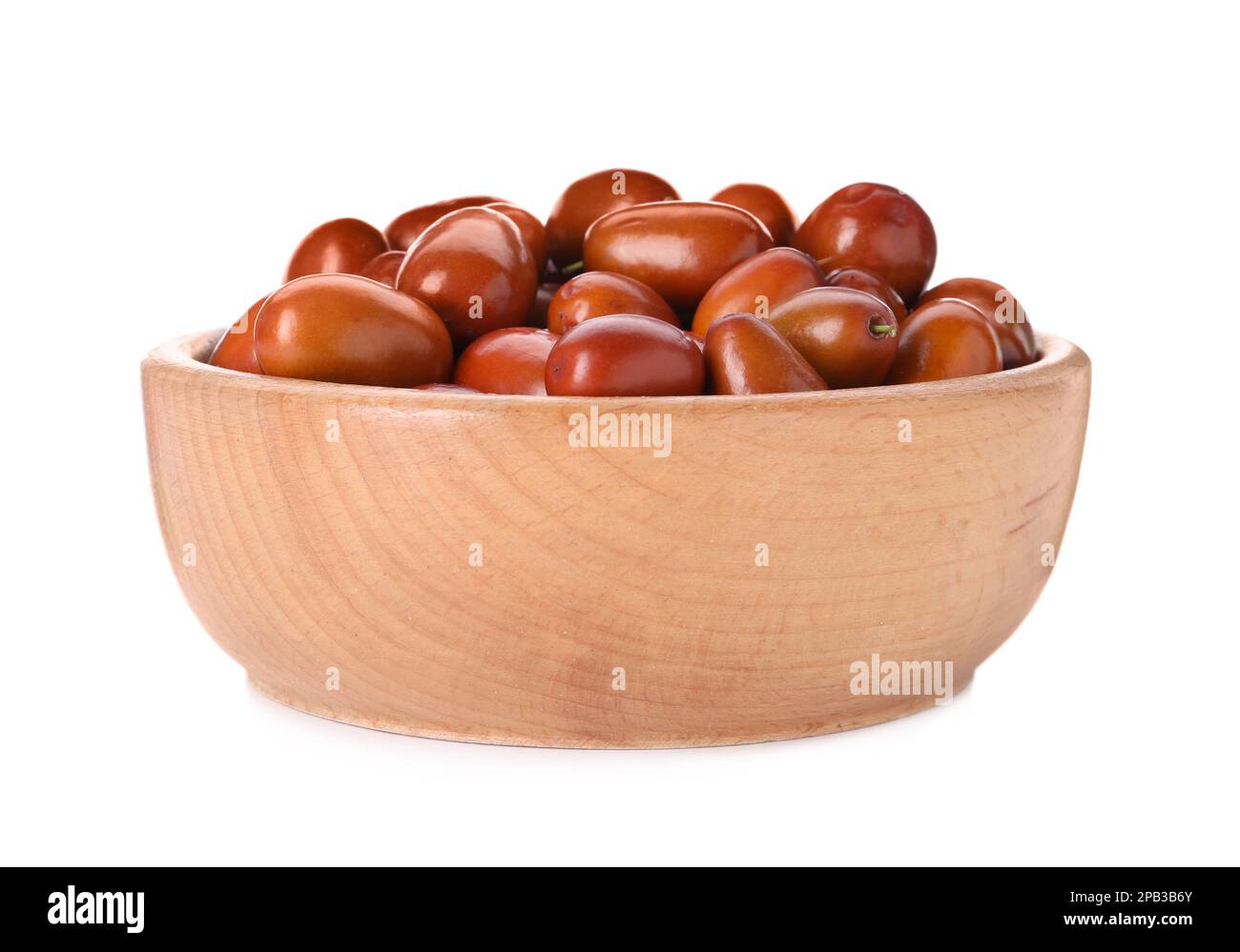 Ripe red dates in wooden bowl on white background Stock Photo - Alamy