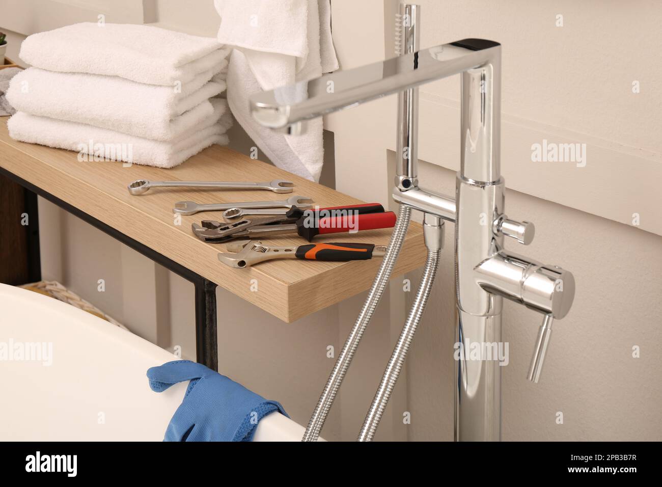 Professional plumbing tools and installed water tap in bathroom Stock ...