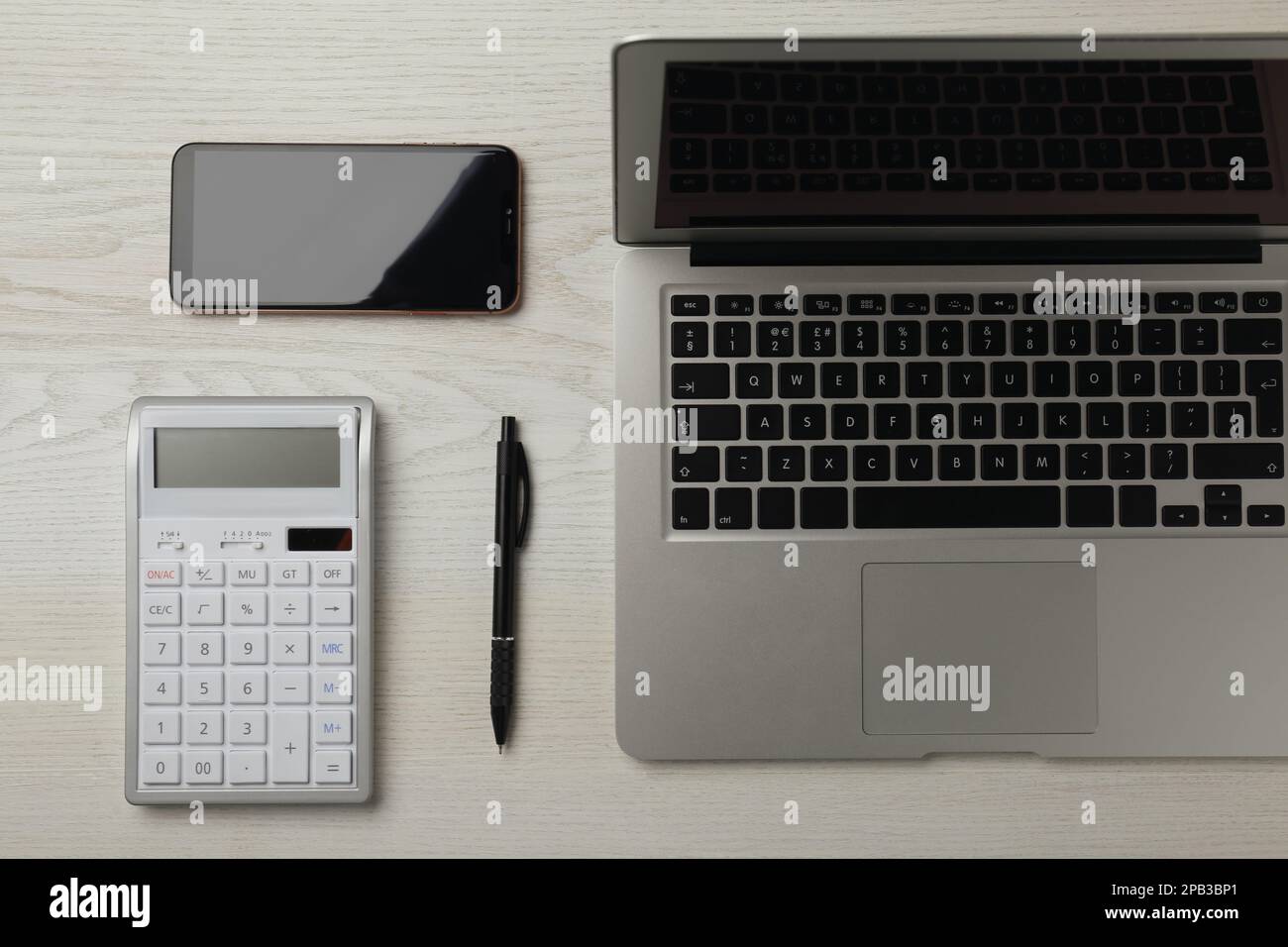 Modern calculator pen laptop hi-res stock photography and images - Alamy