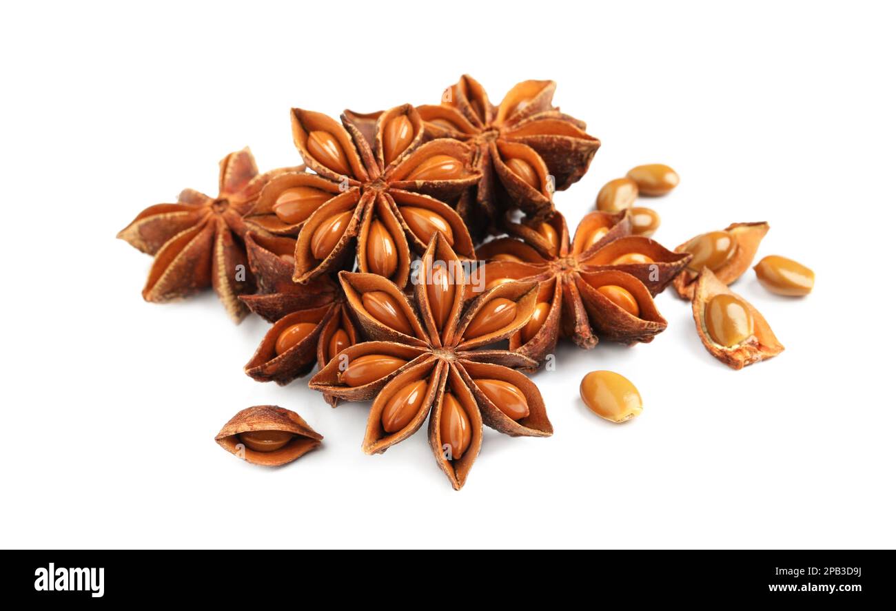 Dry anise stars with seeds on white background Stock Photo - Alamy