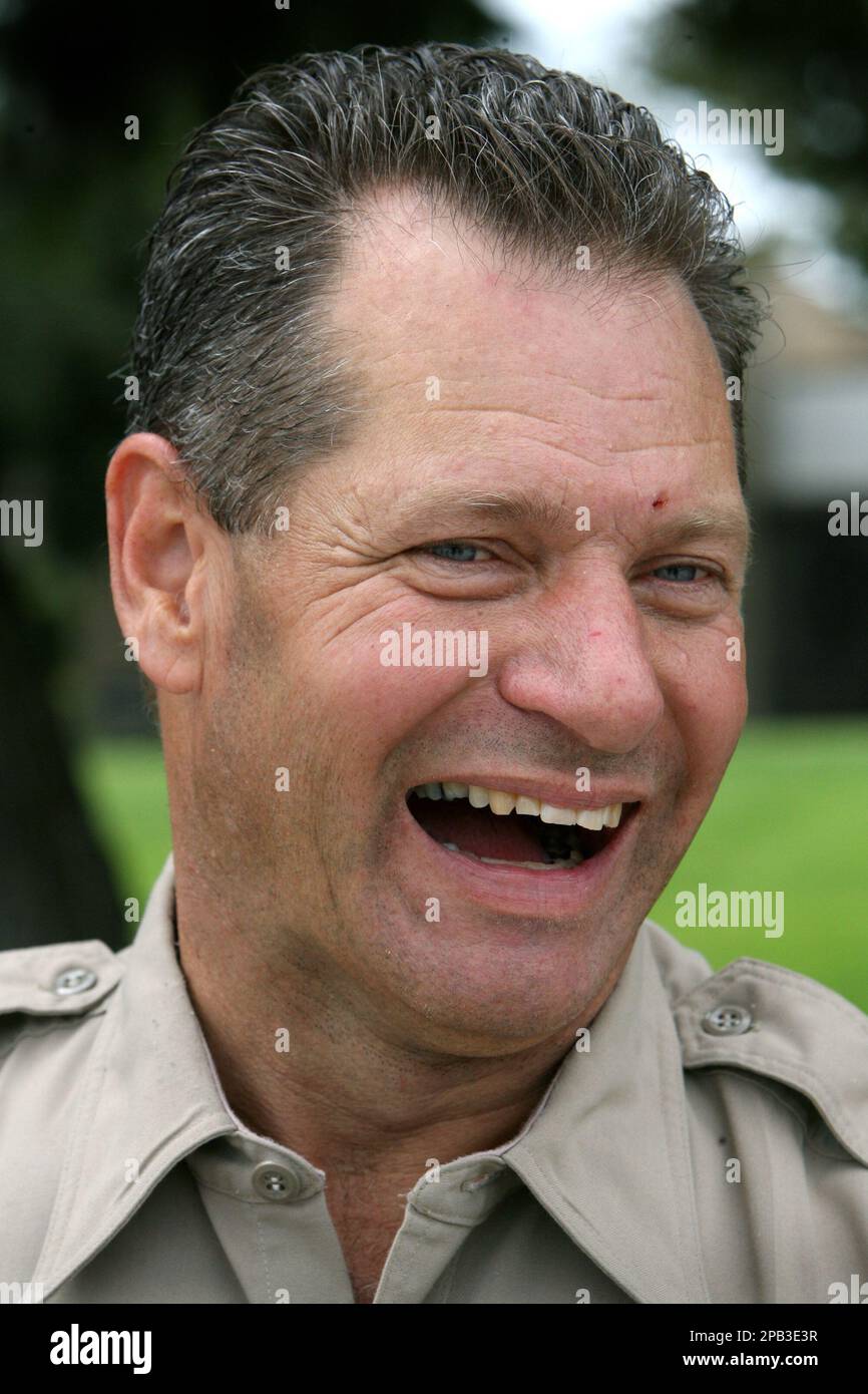 California Highway Patrol Officer Michael Remmel laughs during a visit ...