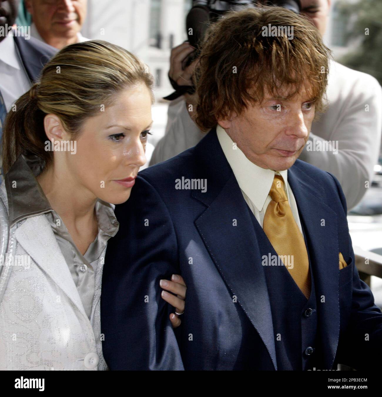 Phil Spector leaves court accompanied by his wife, Rachelle Spector ...