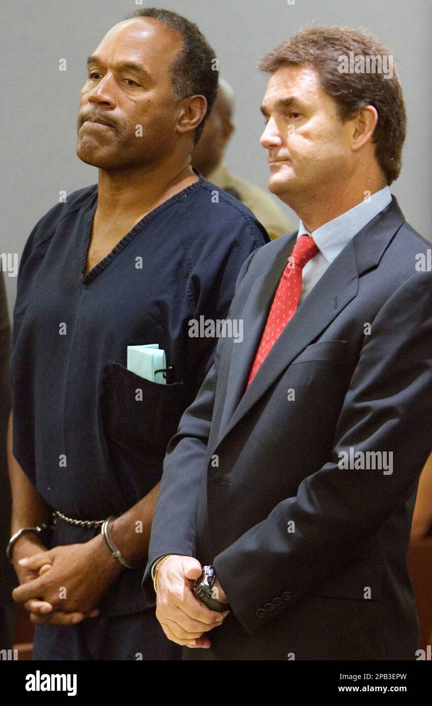 O.J. Simpson, left, stands in Las Vegas Justice Court, for his ...