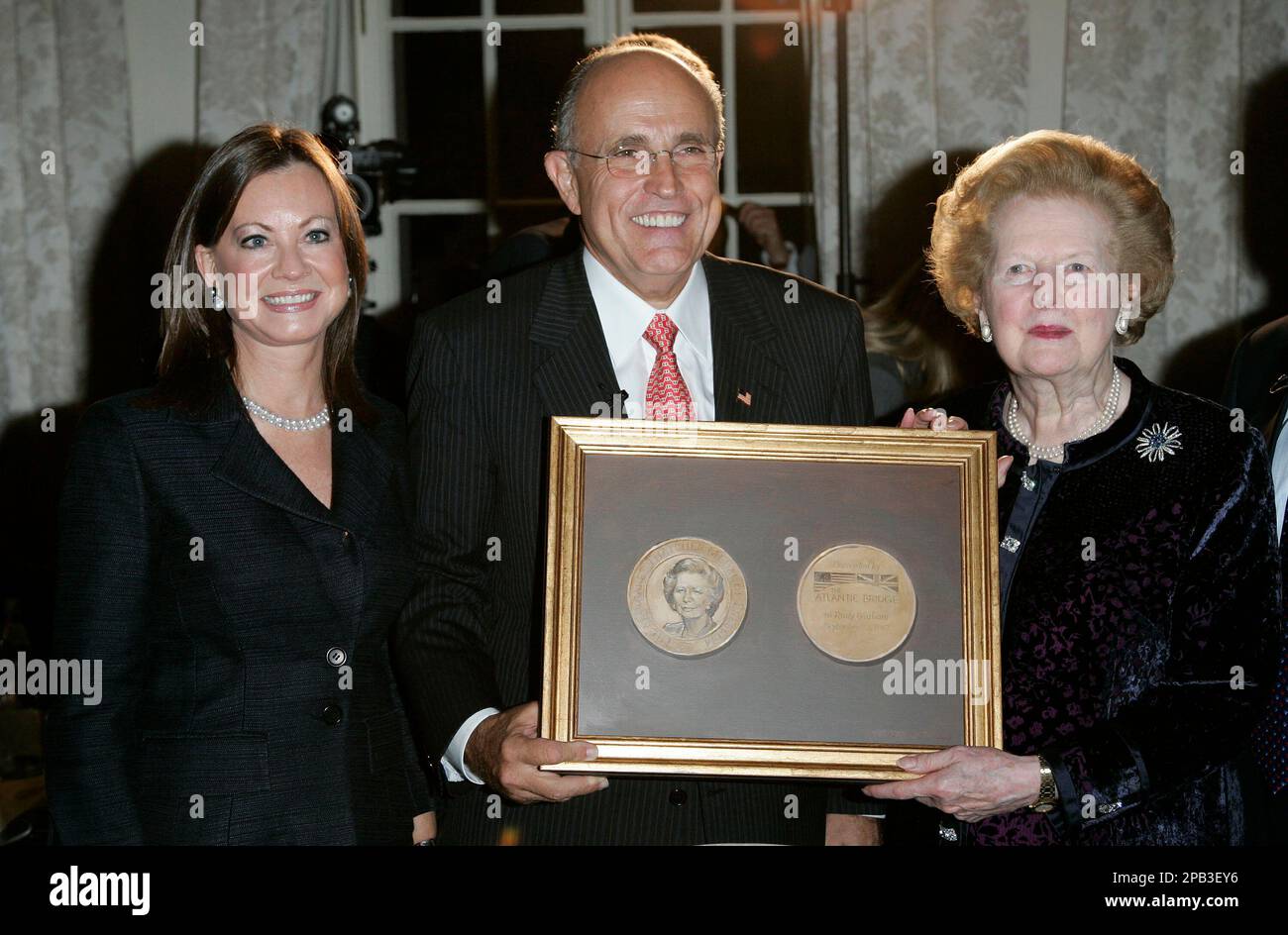 Former New York Mayor Rudy Giuliani, centre, and his wife Judith, left ...
