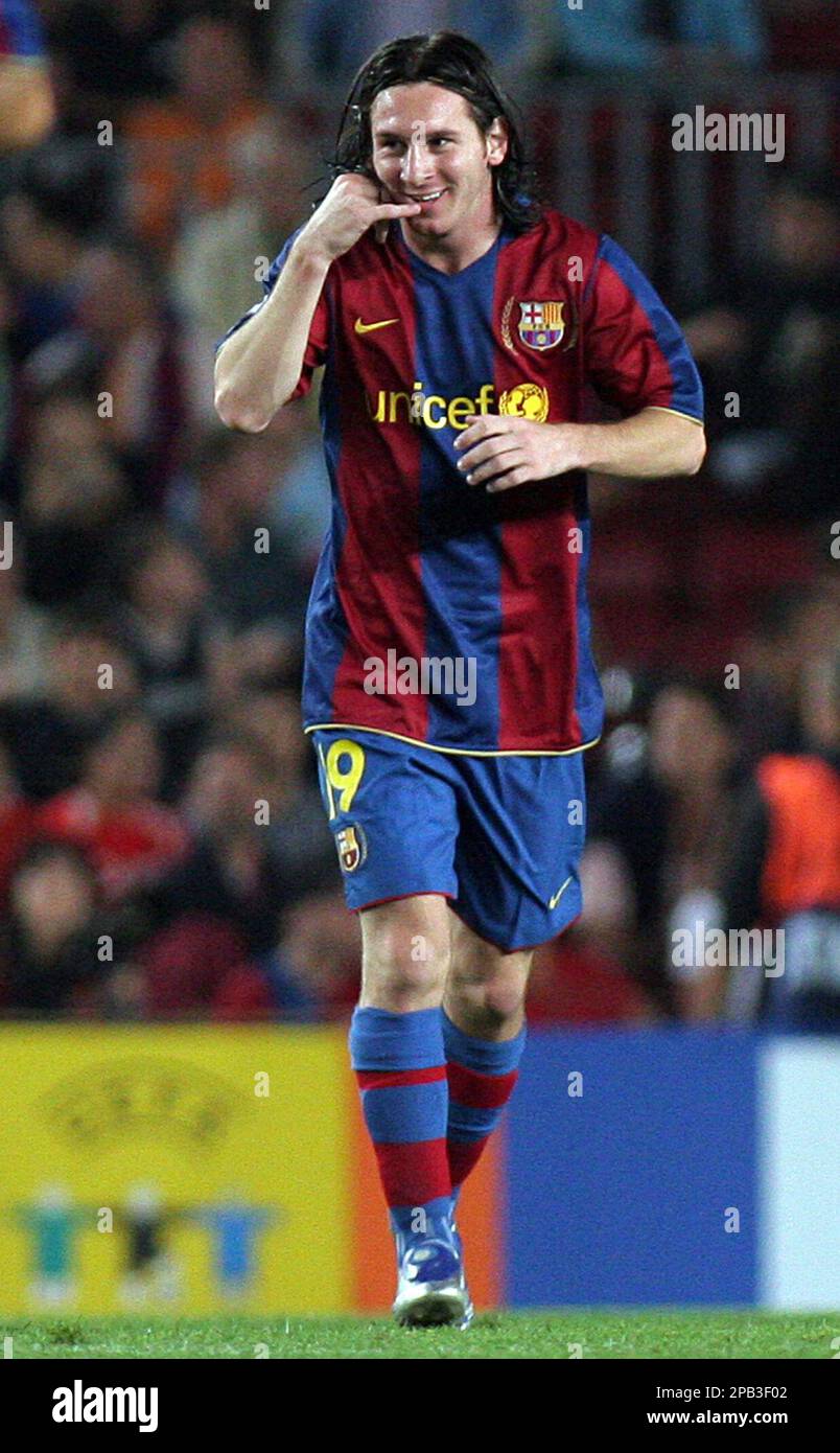 Barcelona's Lionel Messi reacts after scoring against Lyon during their ...