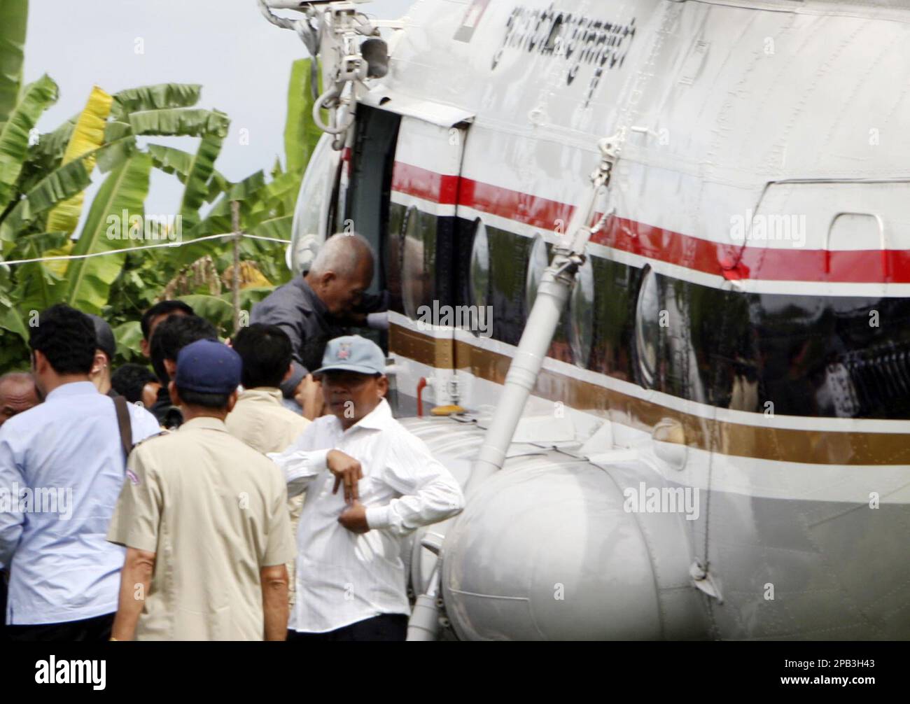 Former Khmer Rouge number two leader Nuon Chea, top, boards a ...