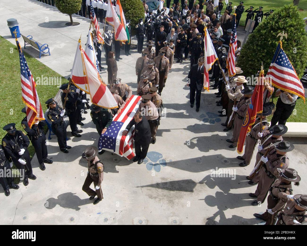 Friends, family and law enforcement officers gather, Tuesday, Sept. 18 ...
