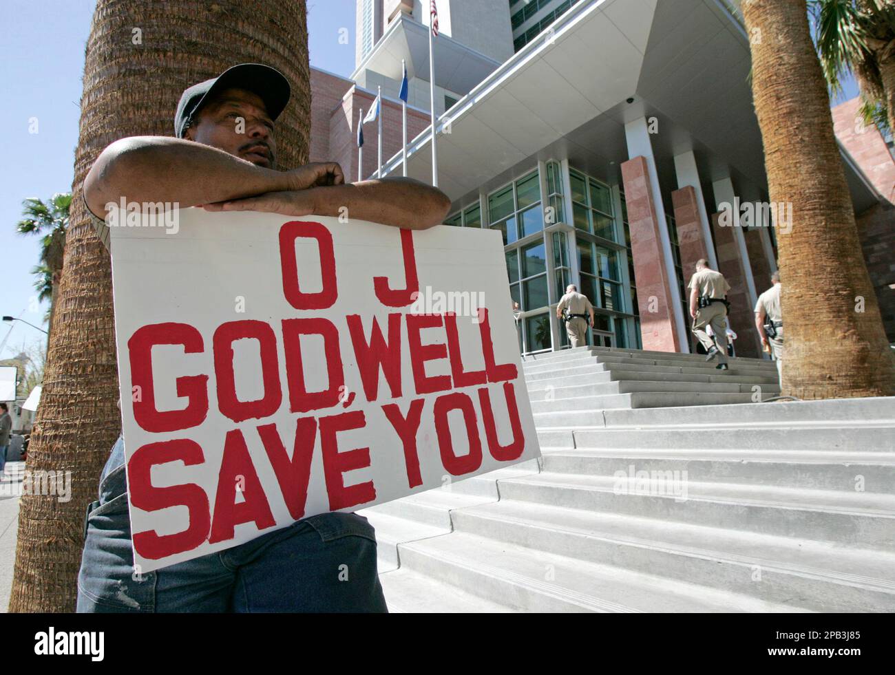 Larry Kincaid, a 43-year-old Las Vegas resident, holds a sign to ...