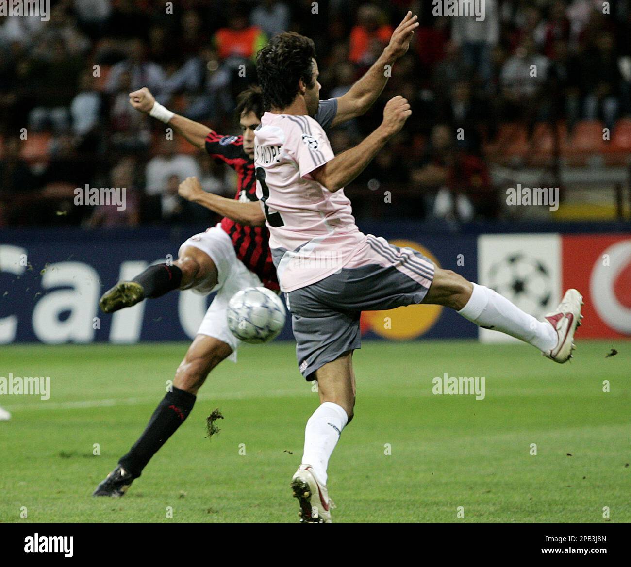 AC Milan forward Filippo Inzaghi, behind, scores past Benfica defender ...