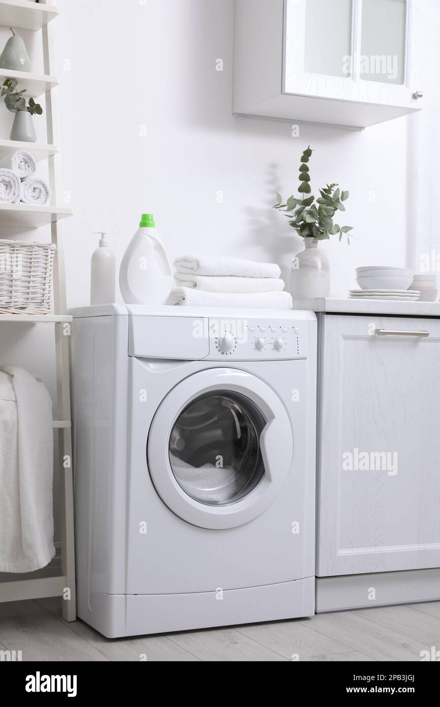 Kitchen interior with washing machine and stylish furniture Stock Photo ...