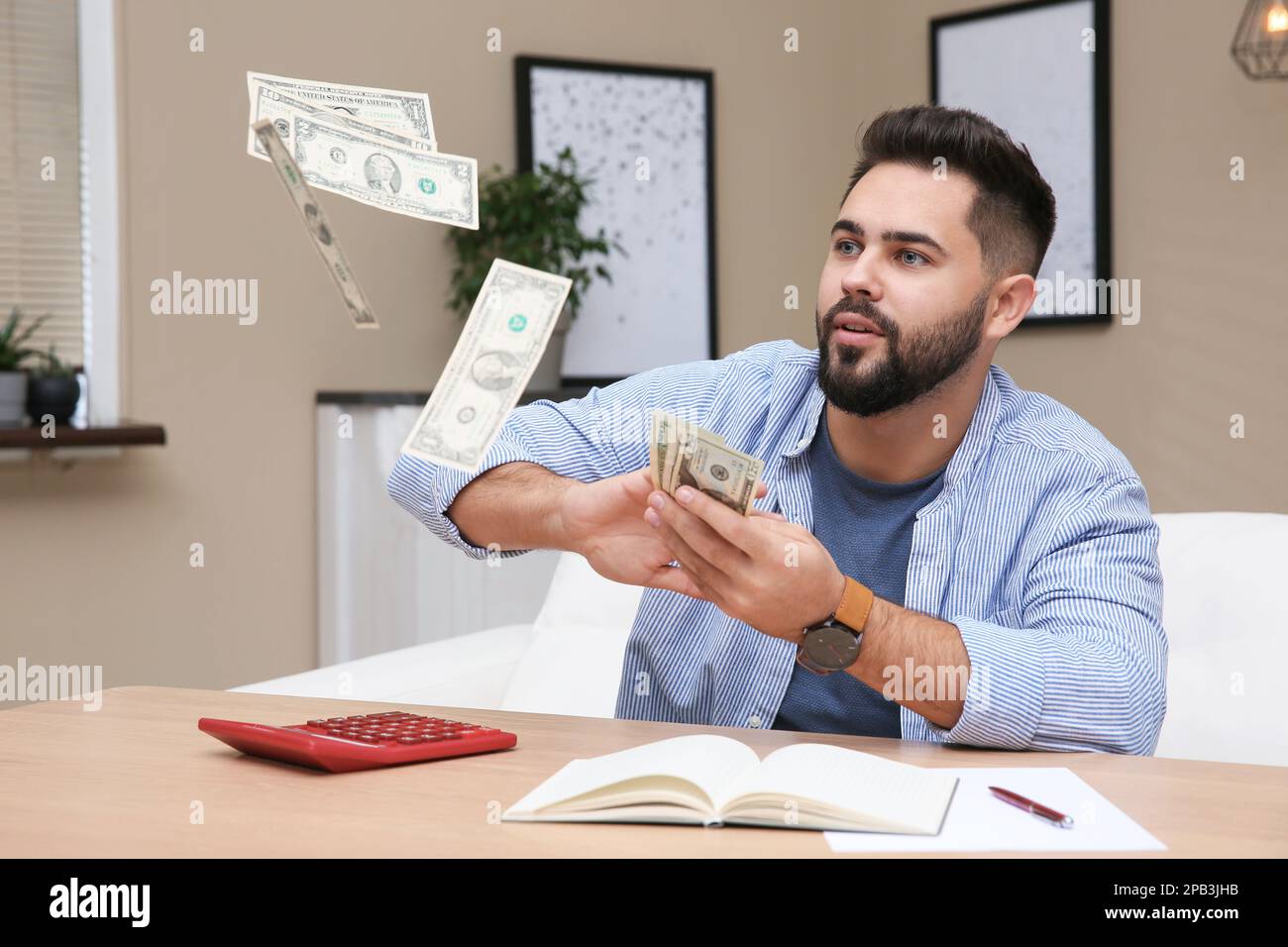 Throwing money and man hi-res stock photography and images - Alamy