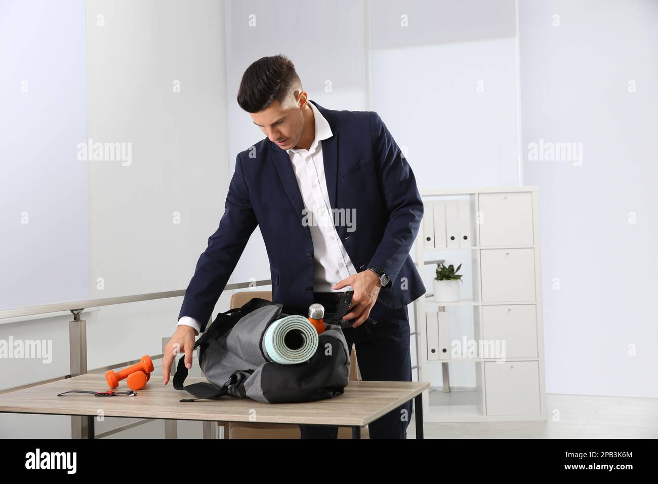 Man packing sports bag hi-res stock photography and images - Alamy
