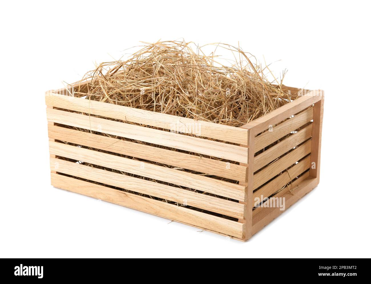 Dried hay in wooden crate on white background Stock Photo - Alamy