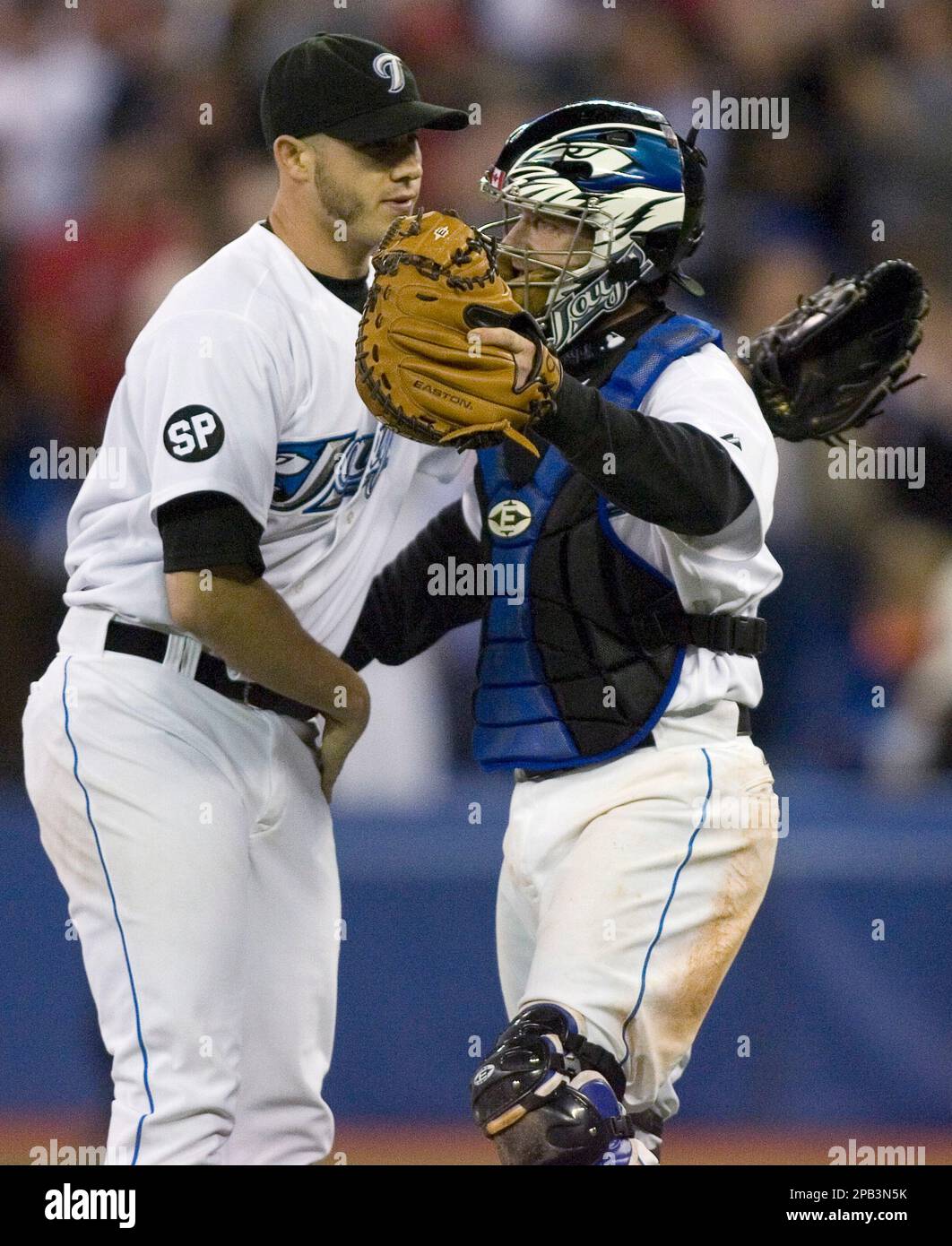 Toronto Blue Jays starting pitcher Dustin McGowan, left, is ...
