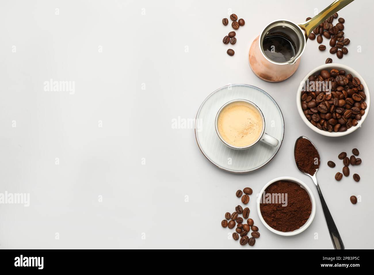 Flat lay composition with coffee grounds and roasted beans on white ...