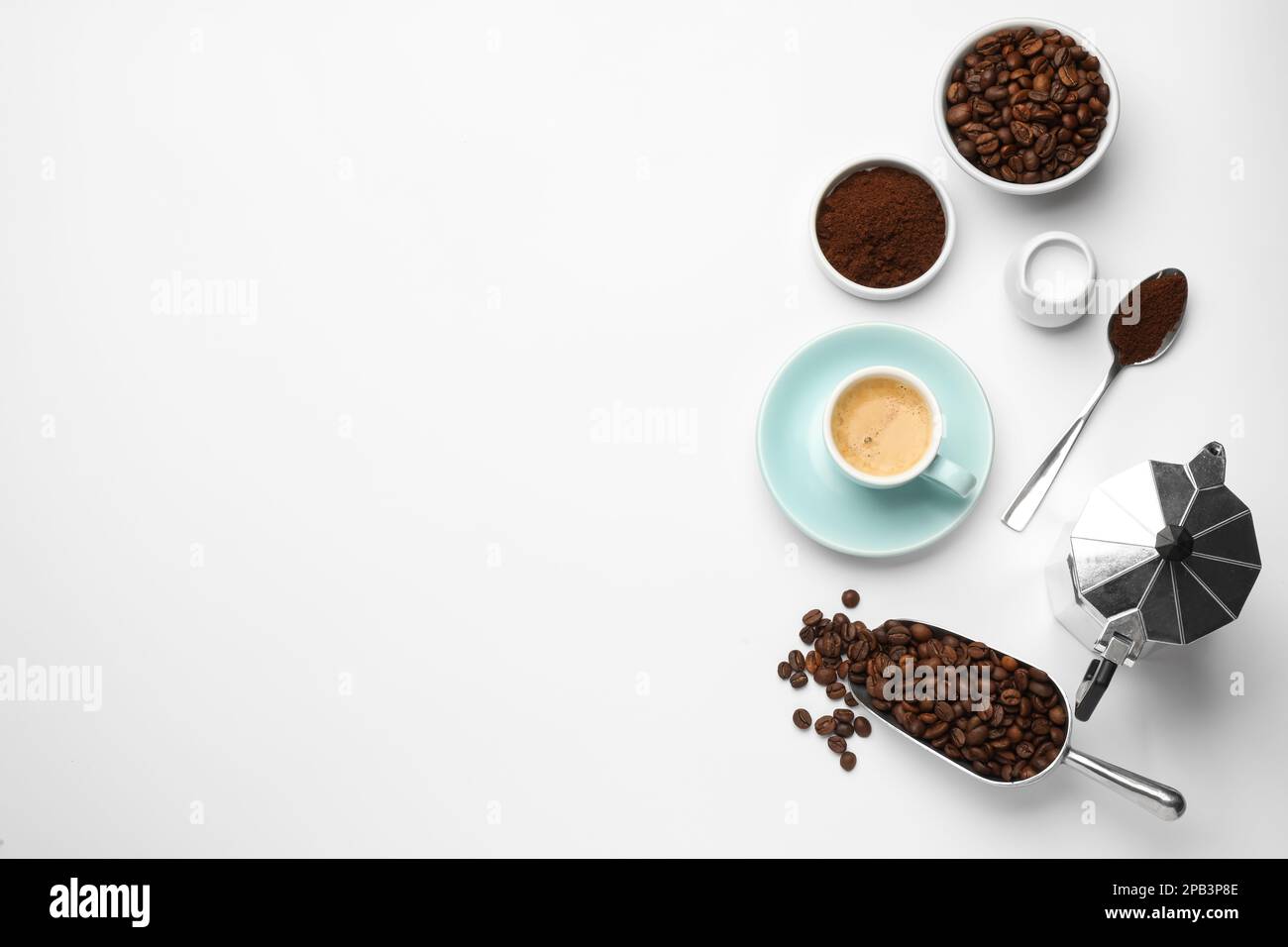 Flat lay composition with coffee grounds and roasted beans on white ...