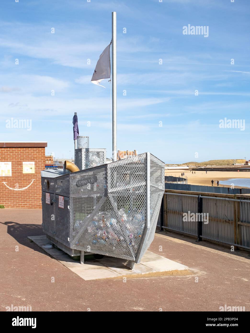 Recycling bin for plastic bottles in the shape of a ship on the ...