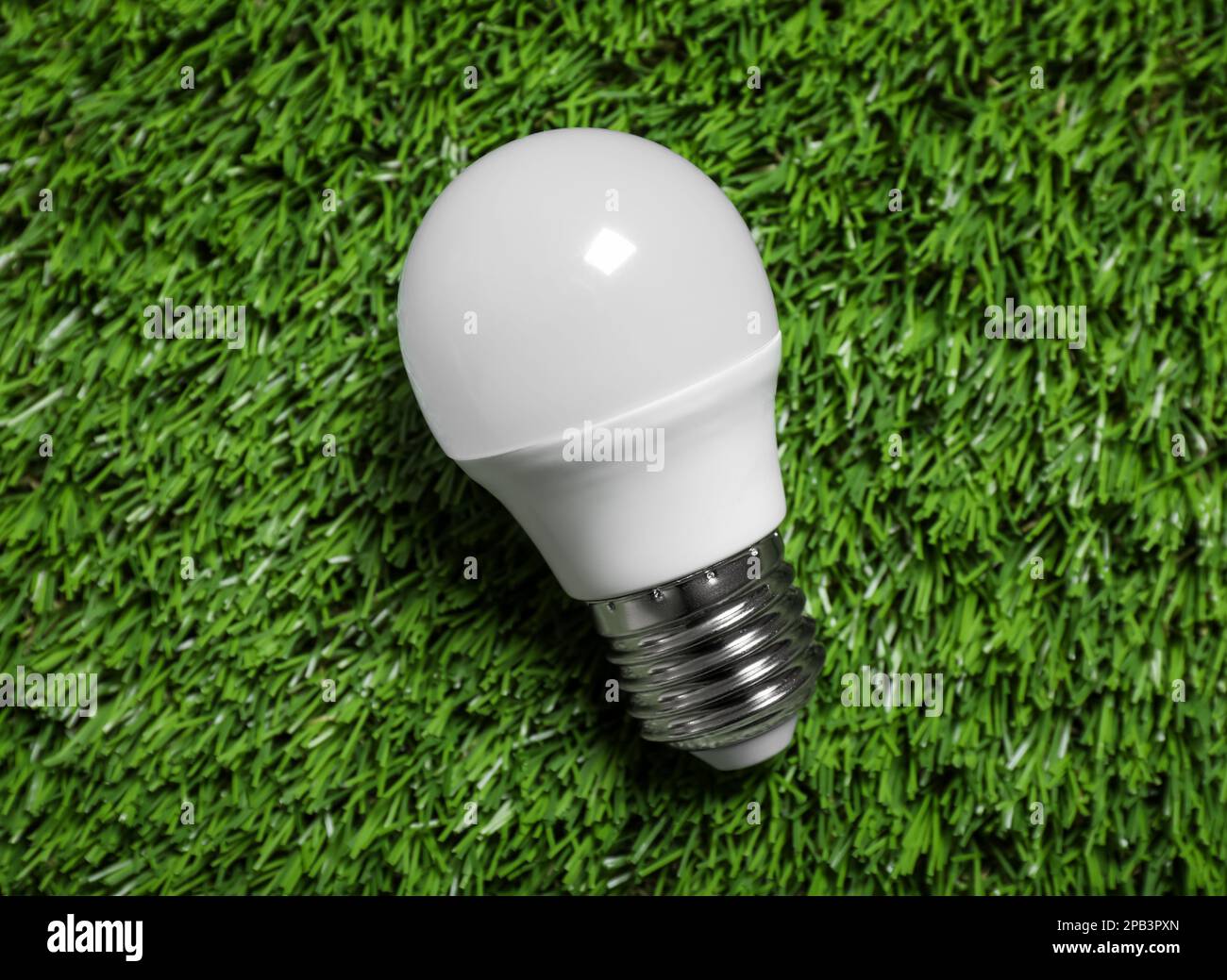 New light bulb on fresh green grass, top view Stock Photo - Alamy