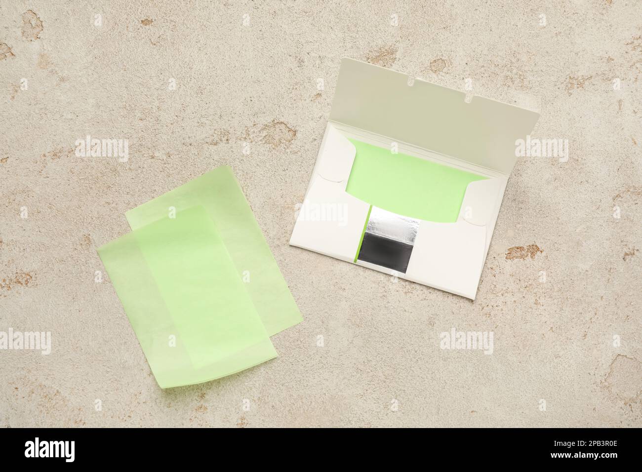 Facial oil blotting tissues on light grey background, flat lay ...