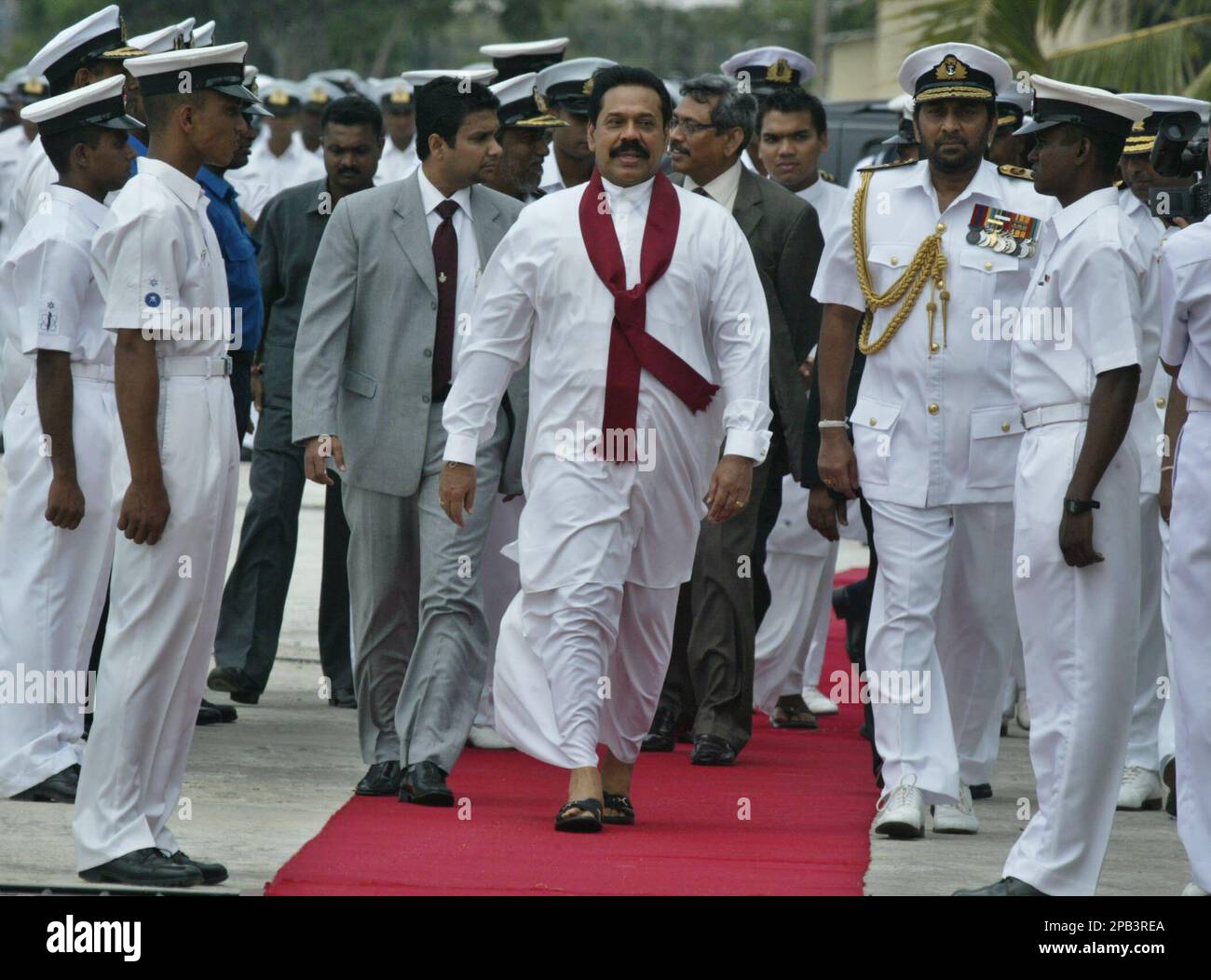 Sri Lankan President Mahinda Rajapakse, center, arrives with Navy ...