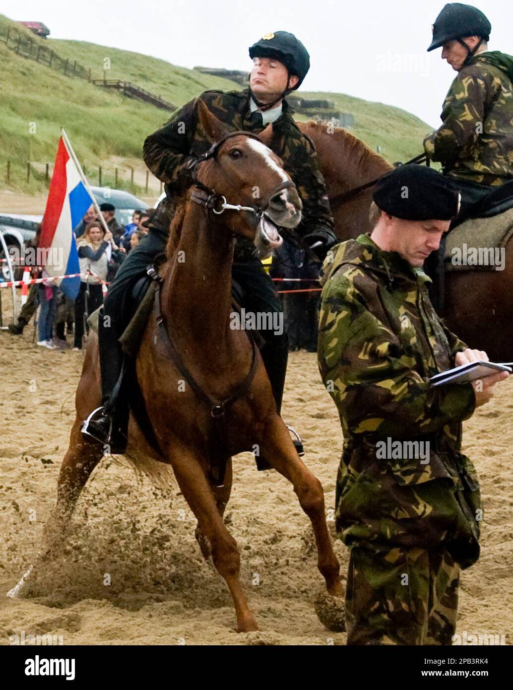 A rider struggles to control his horse during a practice sessions of ...