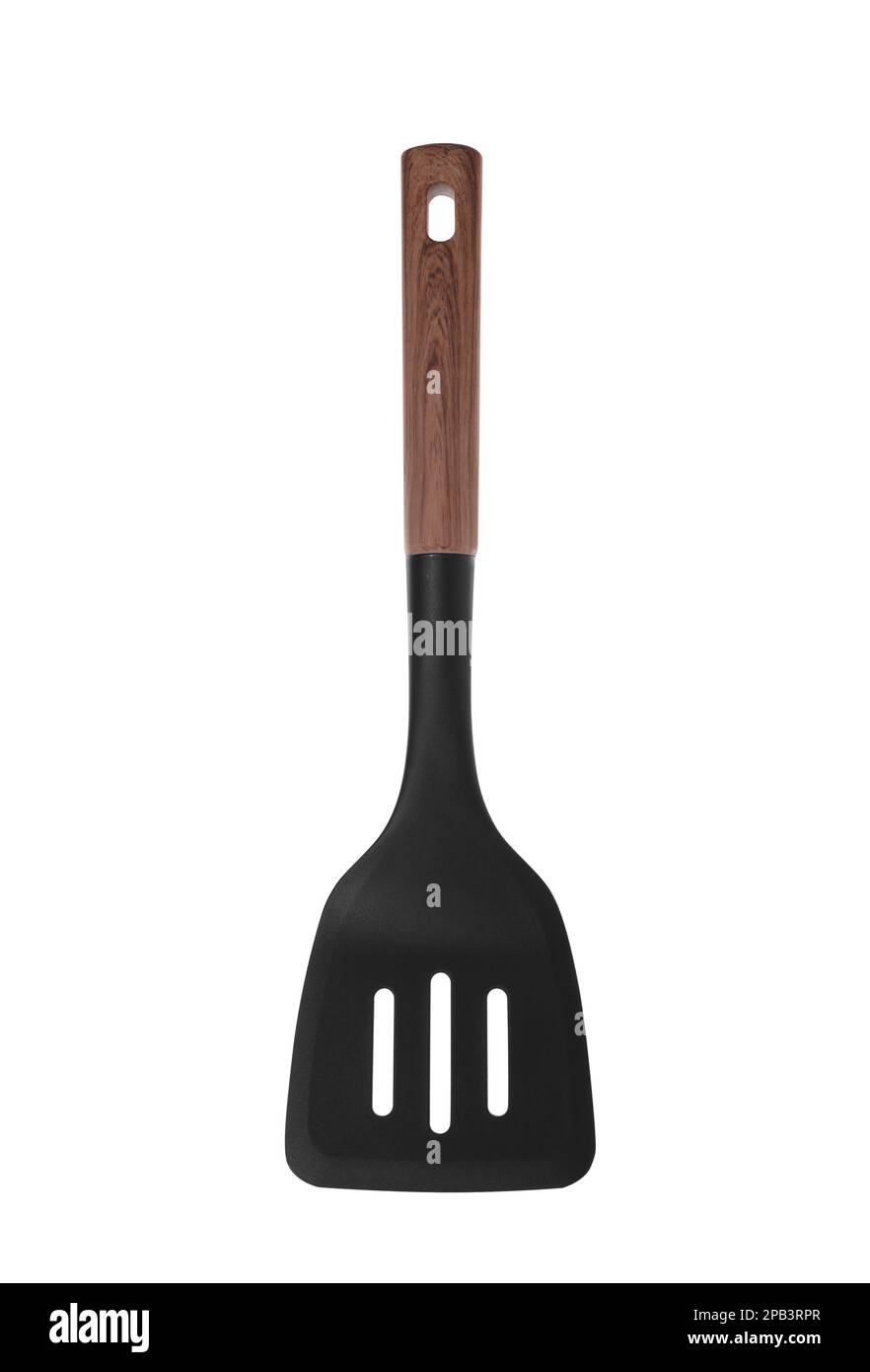 Slotted turner with wooden handle isolated on white. Kitchen utensil ...