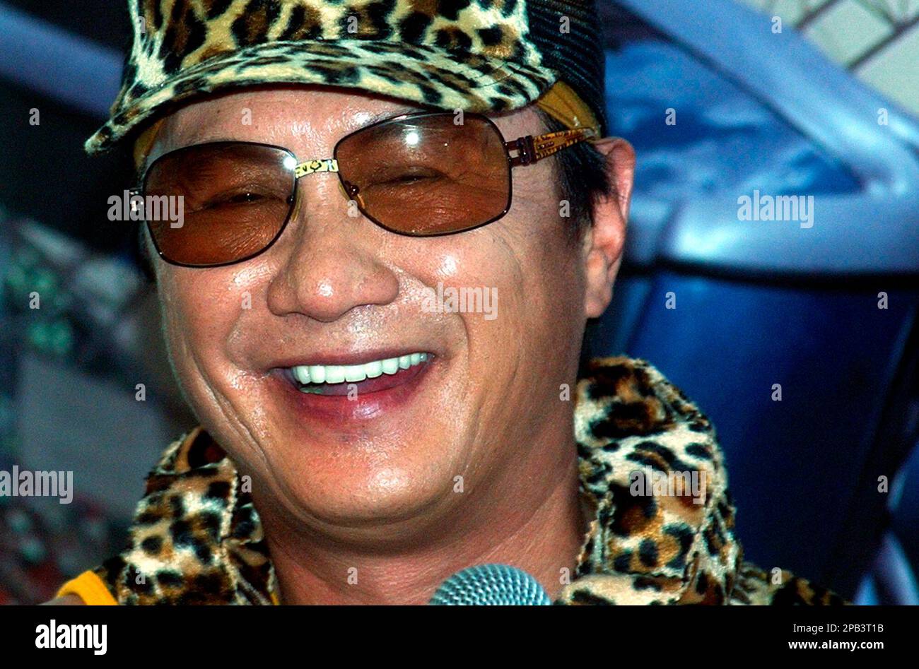 Singer Sam Hui of Hong Kong poses for photographers to promote his ...