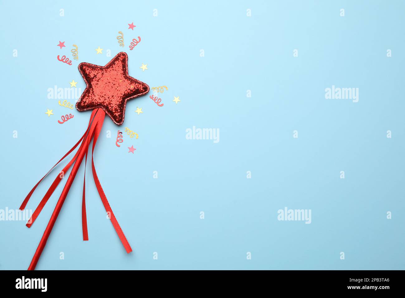 Beautiful red magic wand and confetti on light blue background, flat ...