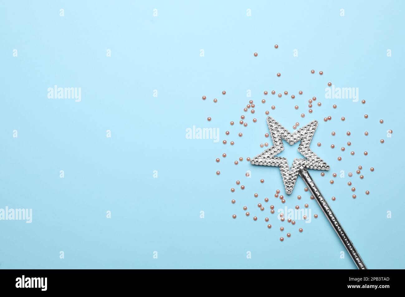 Beautiful silver magic wand and confetti on light blue background, flat ...