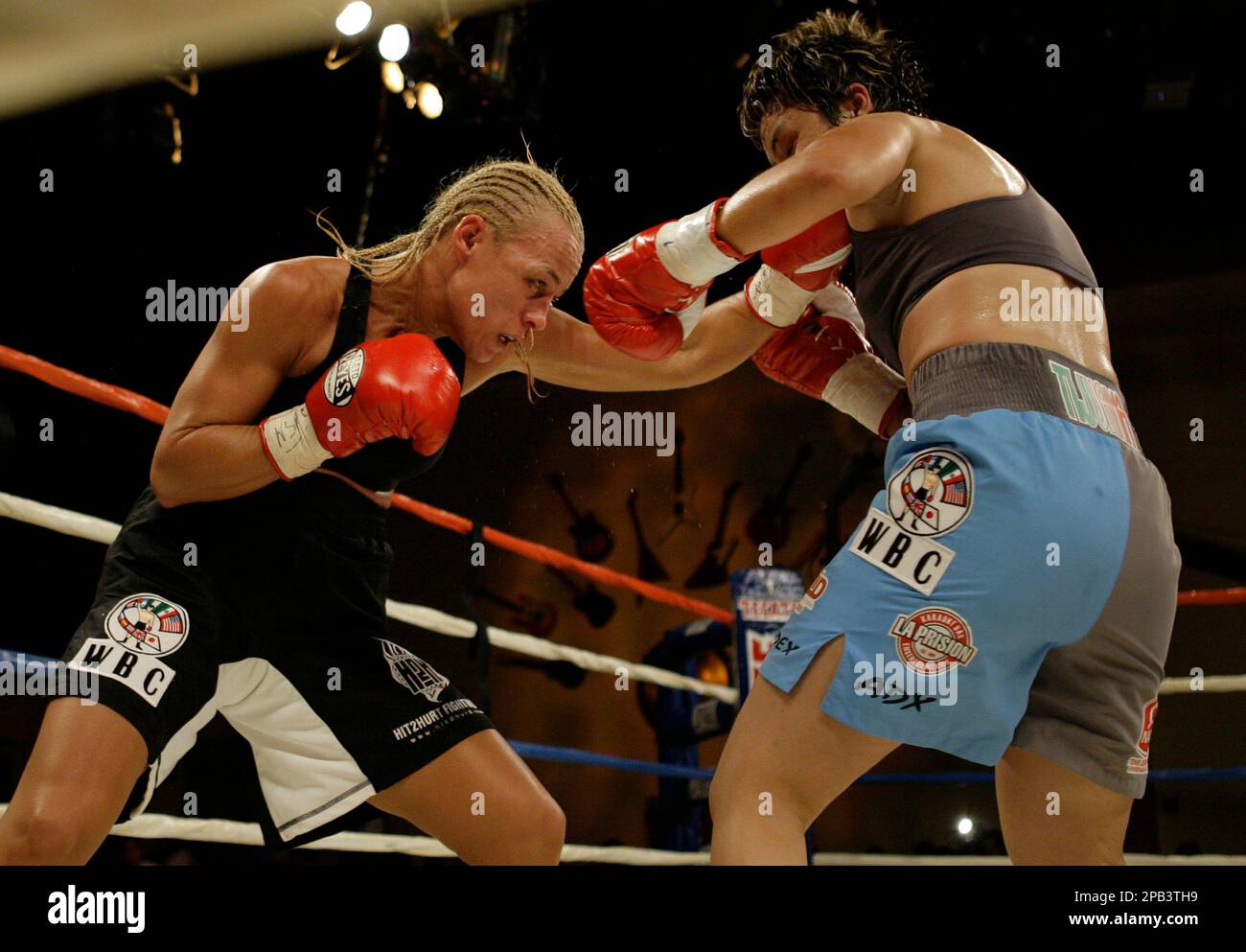 Donna Biggers lands a left hook to Jackie Nava of Mexico during their ...