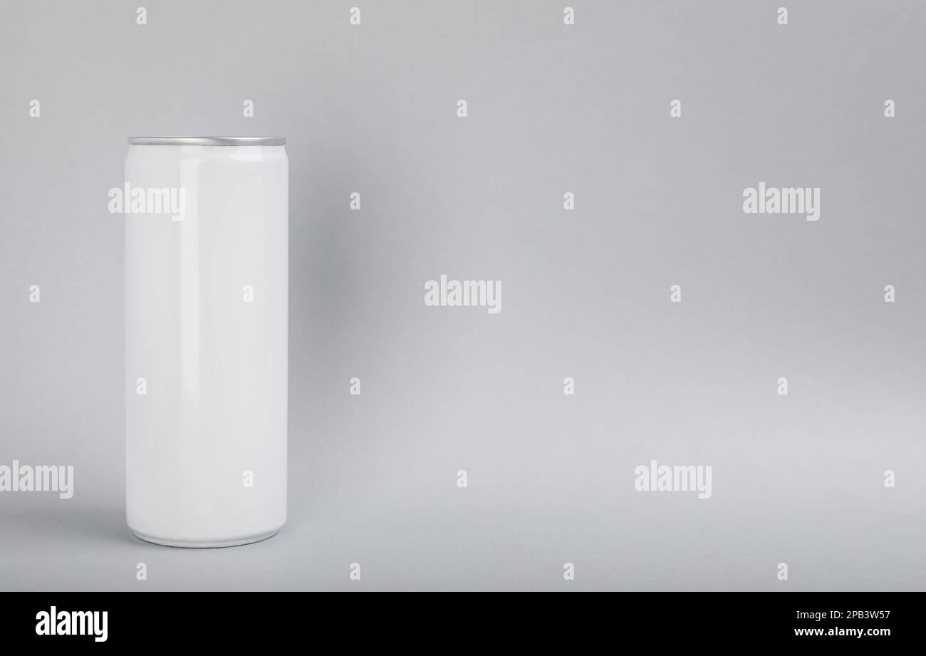 White can of energy drink on light grey background. Space for text ...