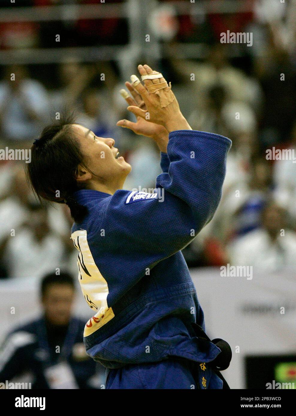 Japan's Ryoko Tani celebrates after winning the gold medal against Cuba ...