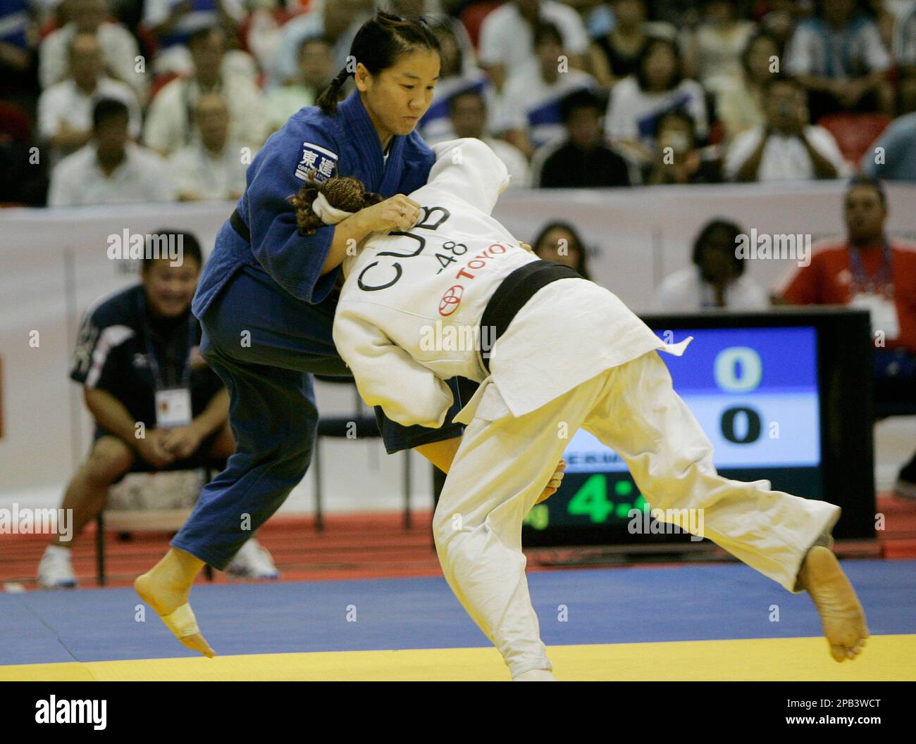 Japan's Ryoko Tani, left, fights with Cuba's Janet Bermoy during the ...